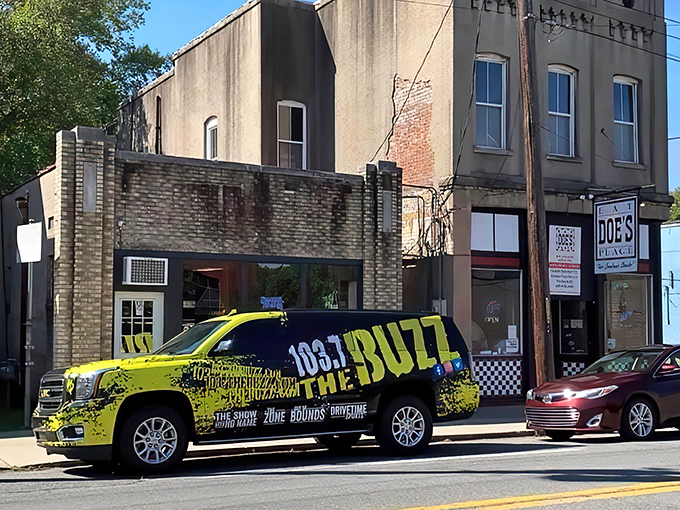 The unassuming exterior of Doe's Eat Place hides culinary greatness within, like finding a diamond in your backyard. That yellow truck knows what's up!