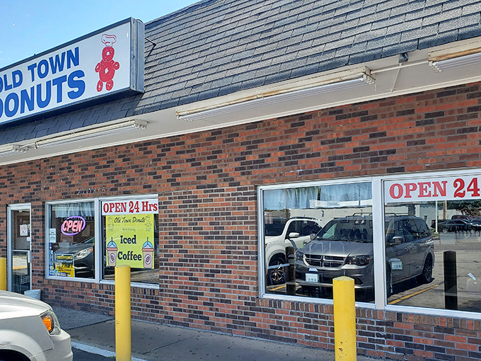 The brick facade of Old Town Donuts stands as a beacon of hope for sugar enthusiasts, promising 24-hour access to fried dough paradise.