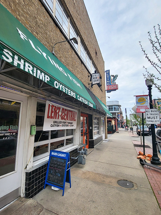 The green awning beckons like a seafood siren song. Flying Fish's no-nonsense exterior promises what fancy restaurants often forget: incredible food without the fuss.