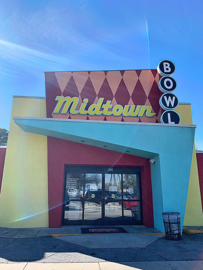 The mid-century facade of Midtown Bowl looks like it could star in its own Wes Anderson film - retro diamonds and all.
