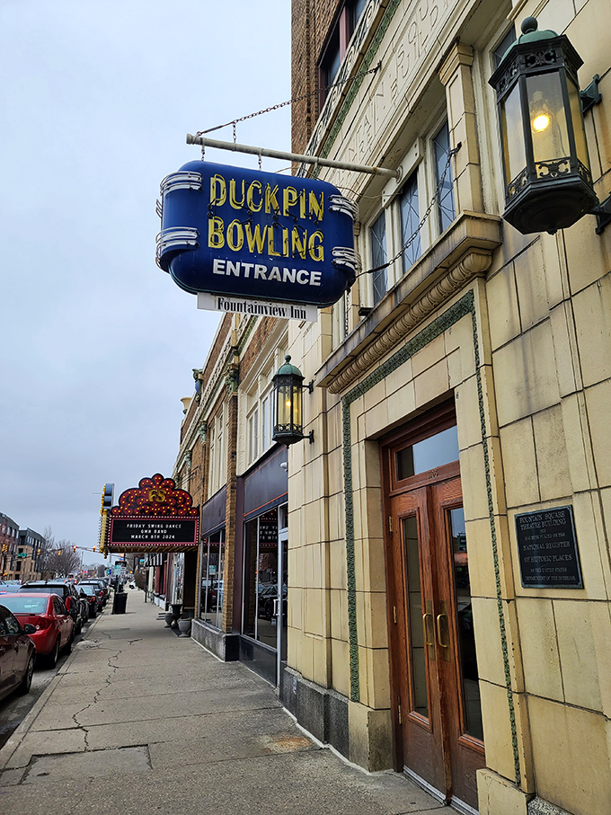 That blue neon sign beckons like a portal to another era&mdash;when entertainment moved at human speed and bowling had character.