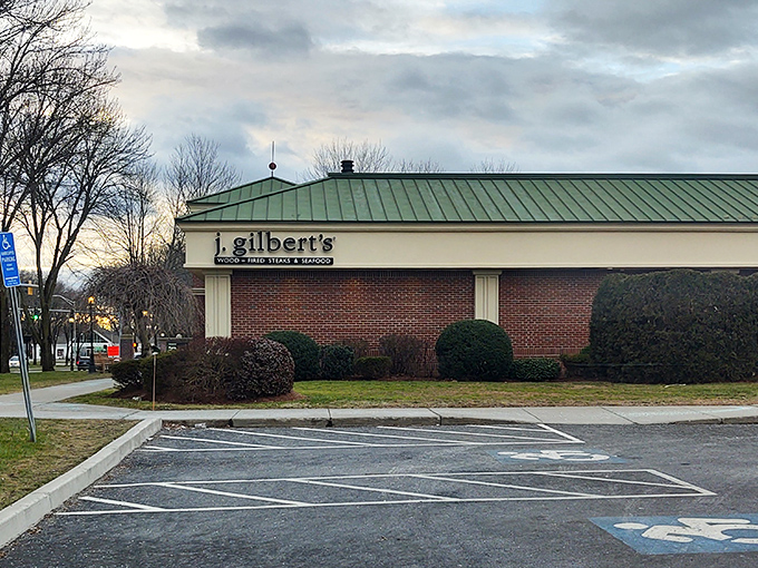 The brick facade of J. Gilbert's stands like a sentry guarding culinary treasures, its arched entrance beckoning hungry pilgrims to the promised land of prime rib.