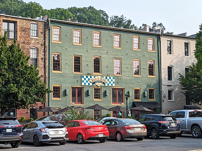 The mint-green historic building with its distinctive checkerboard sign stands like a culinary lighthouse in downtown Staunton, beckoning hungry travelers with promises of comfort.