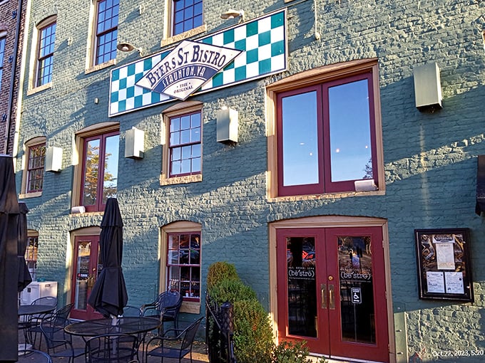 The mint-green historic building with its distinctive checkerboard sign stands like a culinary lighthouse in downtown Staunton, beckoning hungry travelers with promises of comfort.