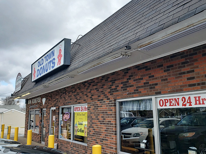 The brick facade of Old Town Donuts stands as a beacon of hope for sugar enthusiasts, promising 24-hour access to fried dough paradise.