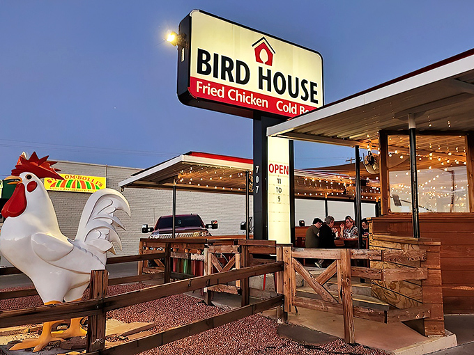 The giant rooster stands sentinel outside BirdHouse like a proud bouncer guarding the gates to crispy chicken paradise.