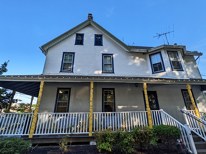 The white farmhouse exterior of Lettie's Kitchen stands like a culinary beacon in Hockessin, promising comfort food that transcends the ordinary.