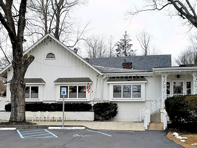 Hollyhock Hill's charming white exterior promises comfort before you even step inside, like a warm hug from your favorite aunt.