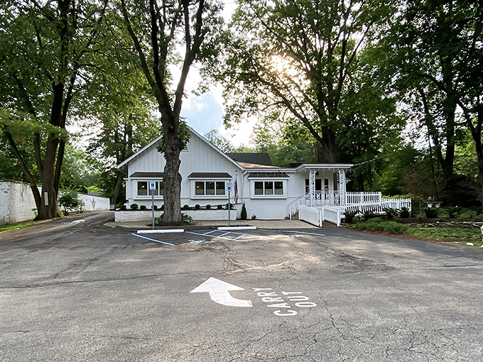 Hollyhock Hill's charming white exterior promises comfort before you even step inside, like a warm hug from your favorite aunt.