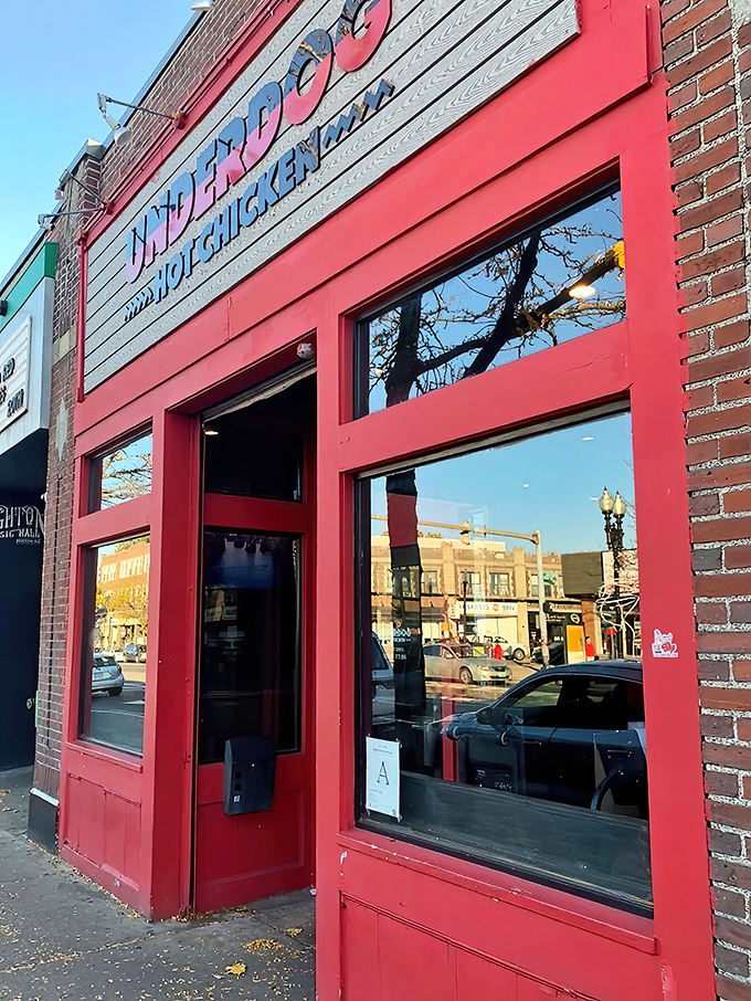 The bold red storefront of Underdog Hot Chicken stands out like a beacon for spice-seekers. Boston's hottest chicken joint announces itself without apology.