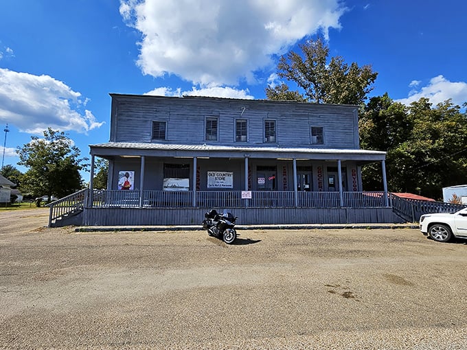 The weathered clapboard exterior of The Old Country Store stands as a time capsule from the 1800s, beckoning hungry travelers with rustic charm. 