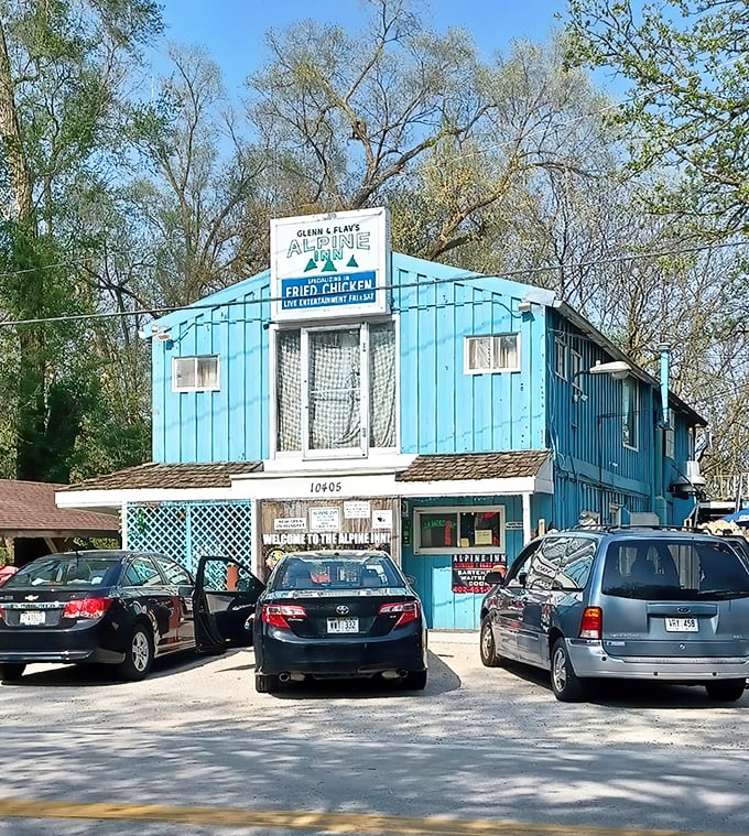 The bright turquoise exterior of Alpine Inn stands like a beacon of comfort food in northeast Omaha, promising fried chicken worth the journey.