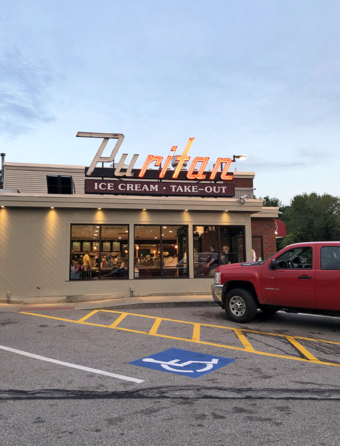 The iconic Puritan sign beckons like an old friend, promising ice cream and take-out treasures that have made Manchester residents swoon for generations.