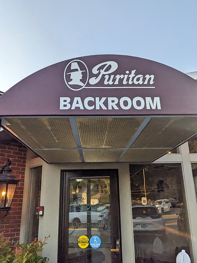 The iconic Puritan sign beckons like an old friend, promising ice cream and take-out treasures that have made Manchester residents swoon for generations.