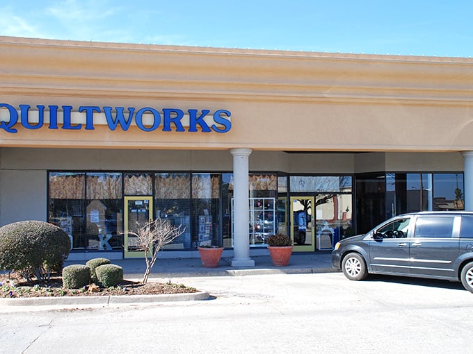 The sunny yellow door of Oklahoma Quiltworks beckons fabric enthusiasts like a textile Bat-Signal. Creative adventures await inside this unassuming storefront. 