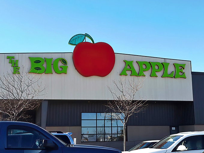 The iconic red apple sign beckons fun-seekers like a beacon of joy amid the Nebraska plains. Entertainment paradise awaits inside!