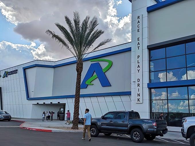 The sleek exterior of Andretti Indoor Karting beckons speed enthusiasts with its modern design and that iconic blue "A" logo&mdash;racing paradise awaits inside.