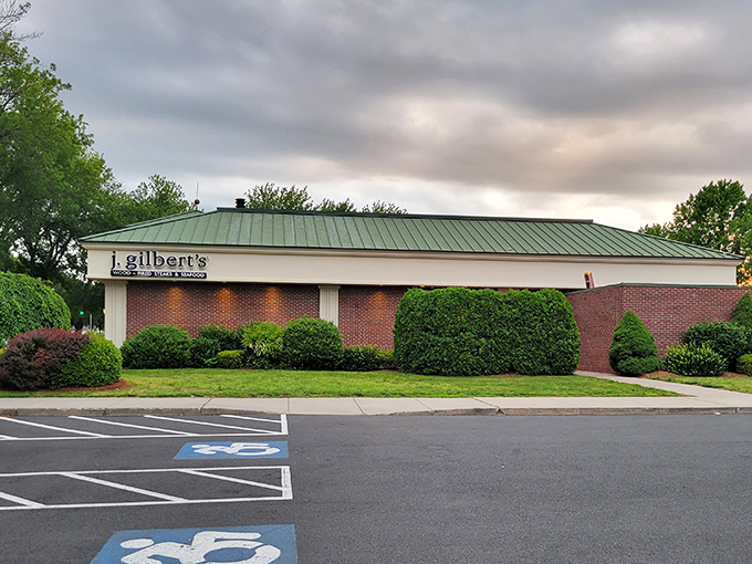 The brick facade of J. Gilbert's stands like a sentry guarding culinary treasures, its arched entrance beckoning hungry pilgrims to the promised land of prime rib.