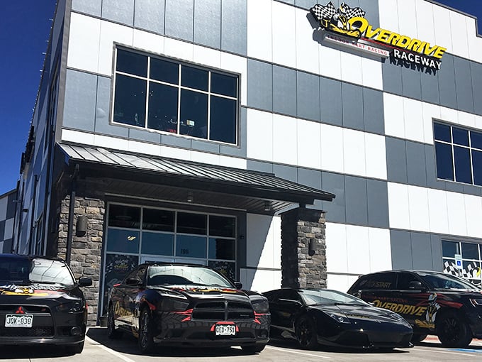 The checkered exterior of Overdrive Raceway stands against Colorado's mountain backdrop like a racing flag waving you toward adventure.