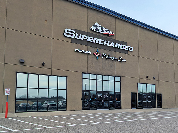 The unassuming exterior hides Connecticut's temple of speed. Like finding a Ferrari dealership inside what looks like an office supply warehouse.