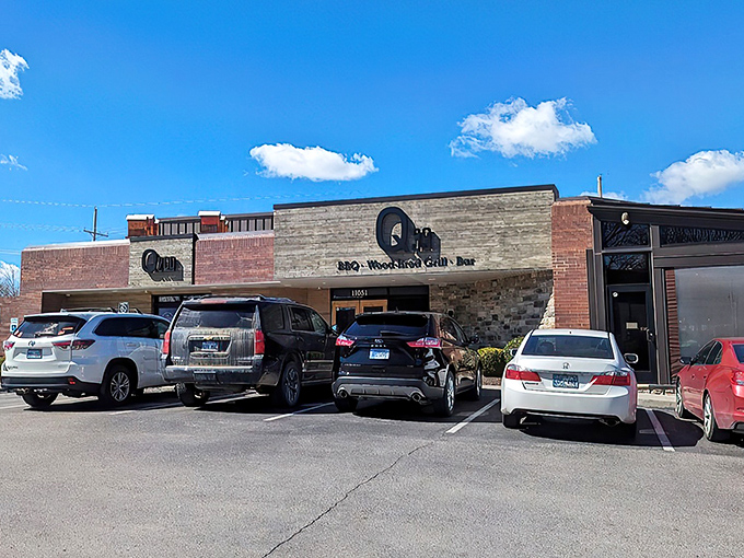The modern rustic facade of Q39 South beckons like a temple of smoke, where wood and stone promise barbecue enlightenment awaits inside.