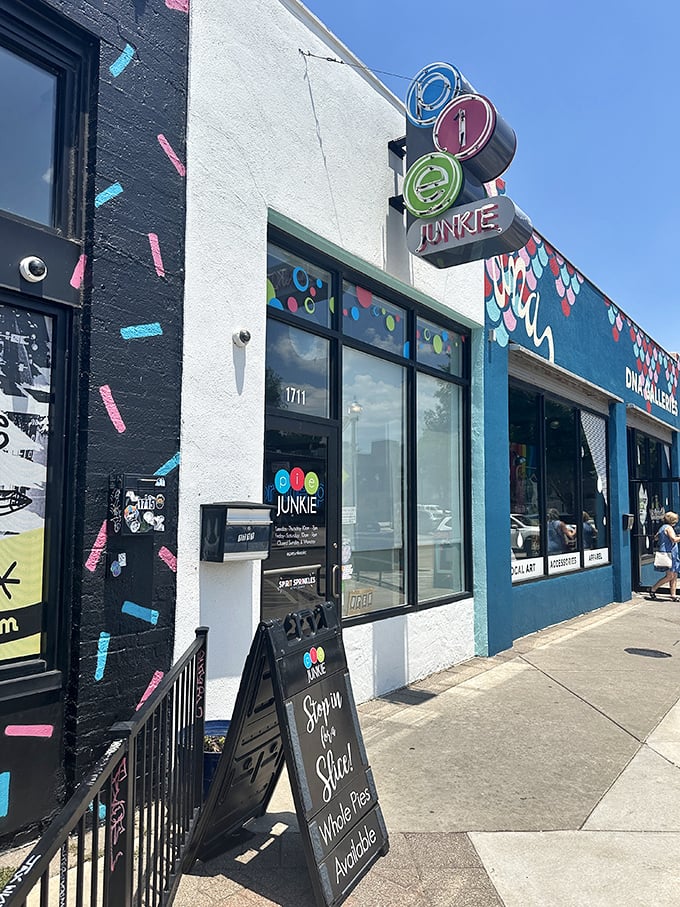 The colorful Pie Junkie storefront beckons like a siren song to dessert lovers. That sign isn't just advertising&mdash;it's a promise of happiness.
