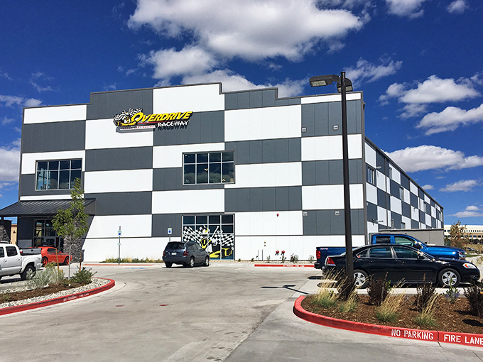 The checkered exterior of Overdrive Raceway stands against Colorado's mountain backdrop like a racing flag waving you toward adventure.