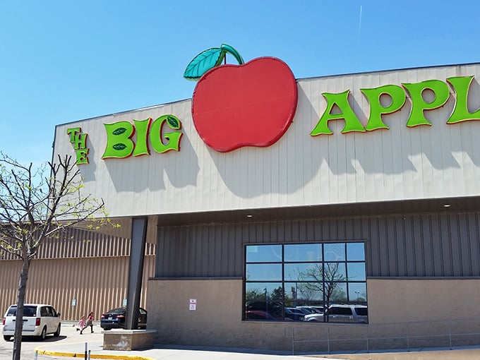 The iconic red apple sign beckons fun-seekers like a beacon of joy amid the Nebraska plains. Entertainment paradise awaits inside!