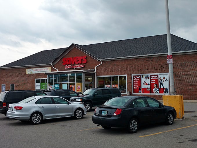 The iconic red Savers sign beckons like a lighthouse for bargain hunters, promising treasures within those brick walls that would make any thrift enthusiast's heart skip a beat.