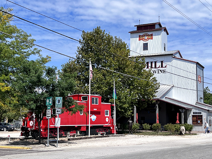 The iconic white exterior of Tin Mill Restaurant stands tall against the Missouri sky, promising German-American delights inside this converted historic building.