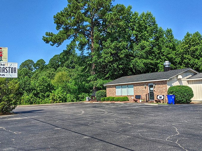 The unassuming exterior hides culinary greatness like a superhero's secret identity. Hungry pilgrims gather outside, knowing what awaits.