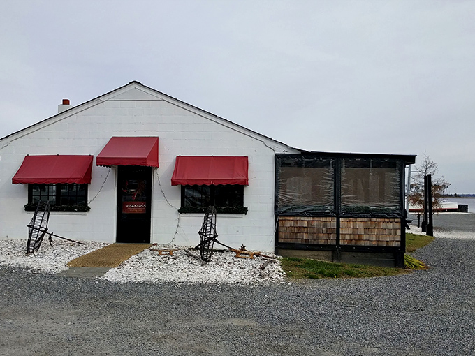 The entrance to seafood paradise - a humble wooden structure with bright orange awnings where Chesapeake Bay magic happens daily.