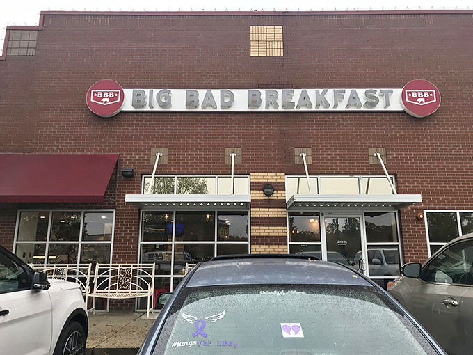 The brick fortress of breakfast dreams announces itself with that bold red awning. Big Bad Breakfast isn't whispering its presence&mdash;it's shouting delicious promises.