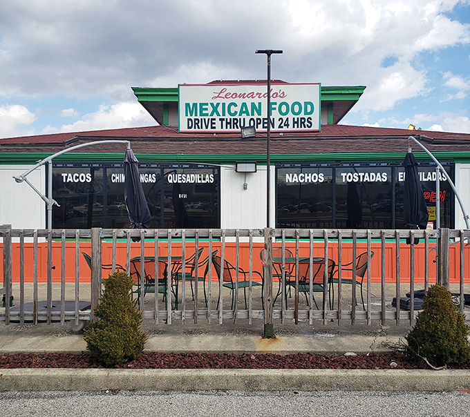 The vibrant red and green exterior of Leonardo's stands like a colorful beacon of culinary promise on Indy's west side.