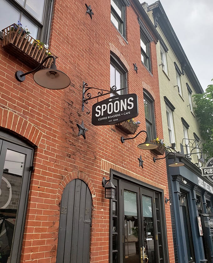 Spoons' classic brick exterior with its understated sign promises culinary treasures within. Federal Hill's breakfast landmark has been drawing crowds since 1999.