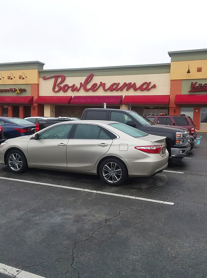 That iconic red neon sign glowing against the dusk sky isn't just advertising bowling&mdash;it's broadcasting a portal back to simpler times.