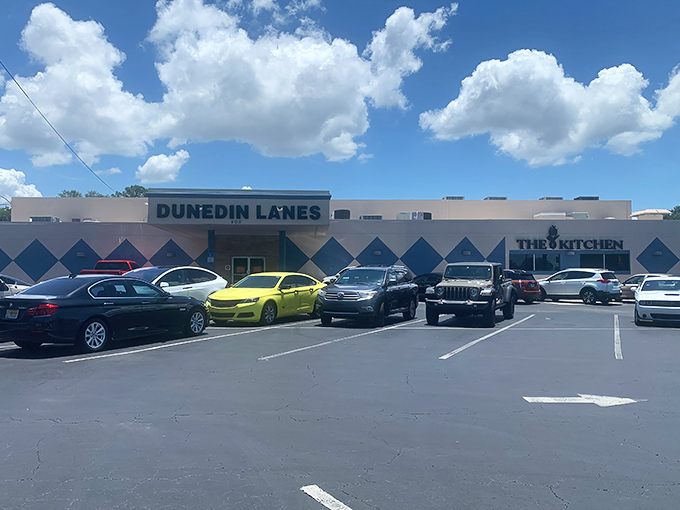 The classic neon-lit entrance to Dunedin Lanes beckons like a portal to simpler times when entertainment didn't require a Wi-Fi password.