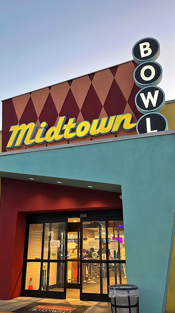 The mid-century facade of Midtown Bowl looks like it could star in its own Wes Anderson film - retro diamonds and all.