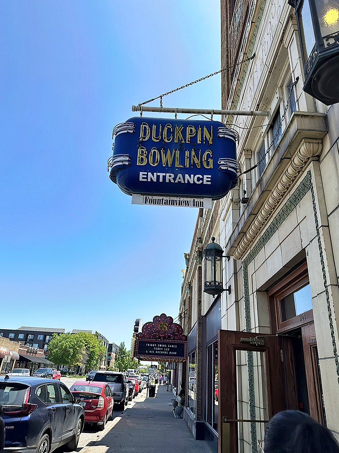 That blue neon sign beckons like a portal to another era&mdash;when entertainment moved at human speed and bowling had character.