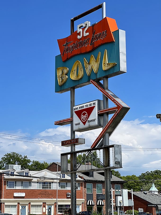 The iconic A-frame entrance of Tropicana Lanes stands like a mid-century time portal, complete with that space-age bowling pin perched proudly on top. 