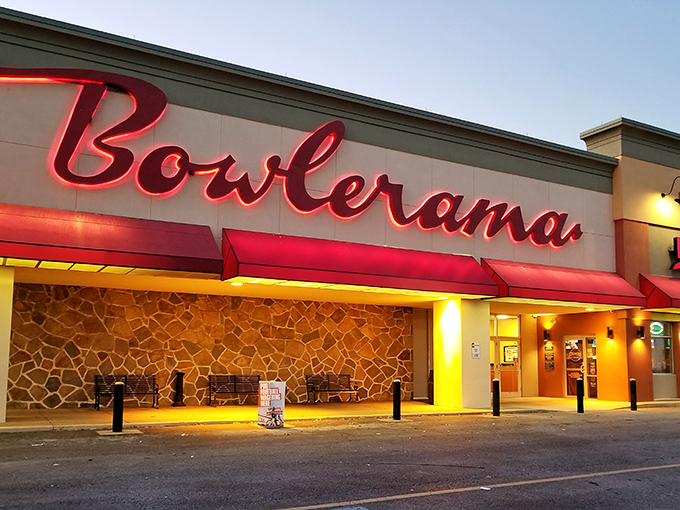 That iconic red neon sign glowing against the dusk sky isn't just advertising bowling&mdash;it's broadcasting a portal back to simpler times.
