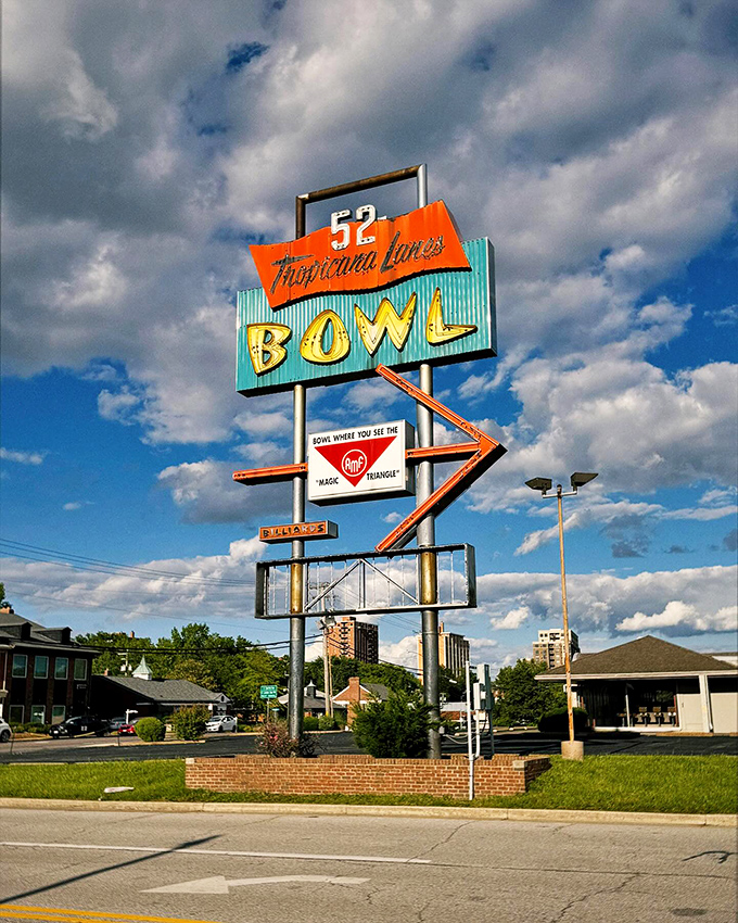 The iconic A-frame entrance of Tropicana Lanes stands like a mid-century time portal, complete with that space-age bowling pin perched proudly on top.