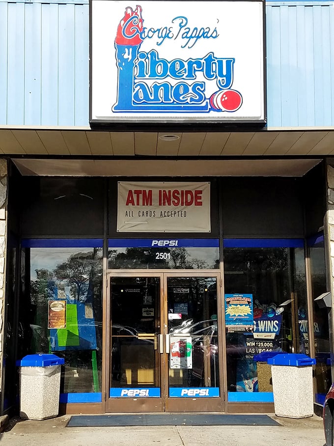 The classic stone facade and iconic blue signage of Liberty Lanes stands as a time capsule of American recreation&mdash;where memories are made one frame at a time. 