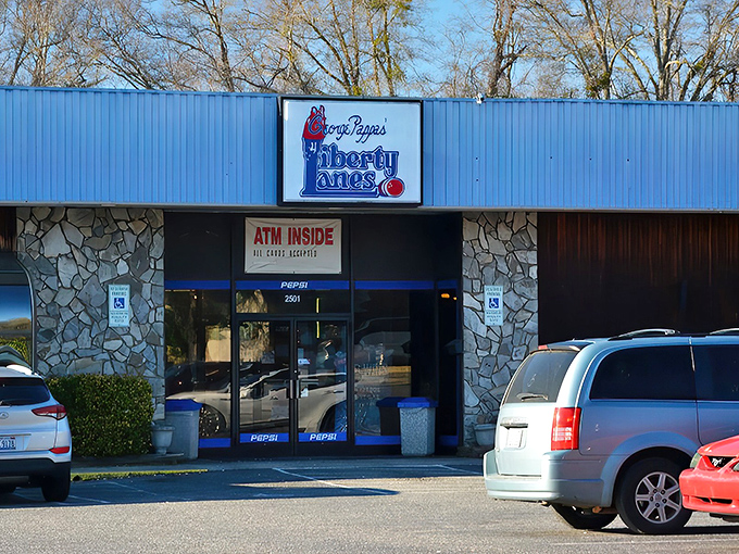 The classic stone facade and iconic blue signage of Liberty Lanes stands as a time capsule of American recreation&mdash;where memories are made one frame at a time.