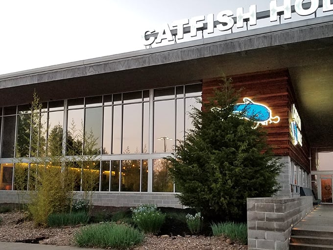 The Catfish Hole's modern exterior might fool you, but that blue catfish sign promises old-school Southern delights waiting inside.