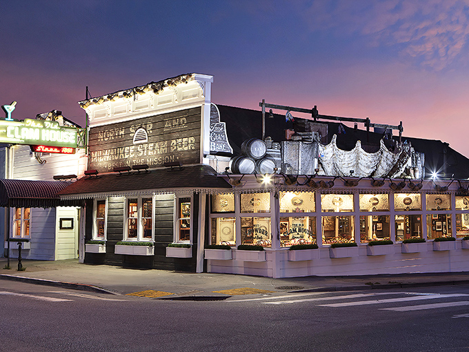 Twilight transforms this 1861 seafood sanctuary into a maritime mirage. The vintage neon sign beckons hungry travelers like a lighthouse for the famished.