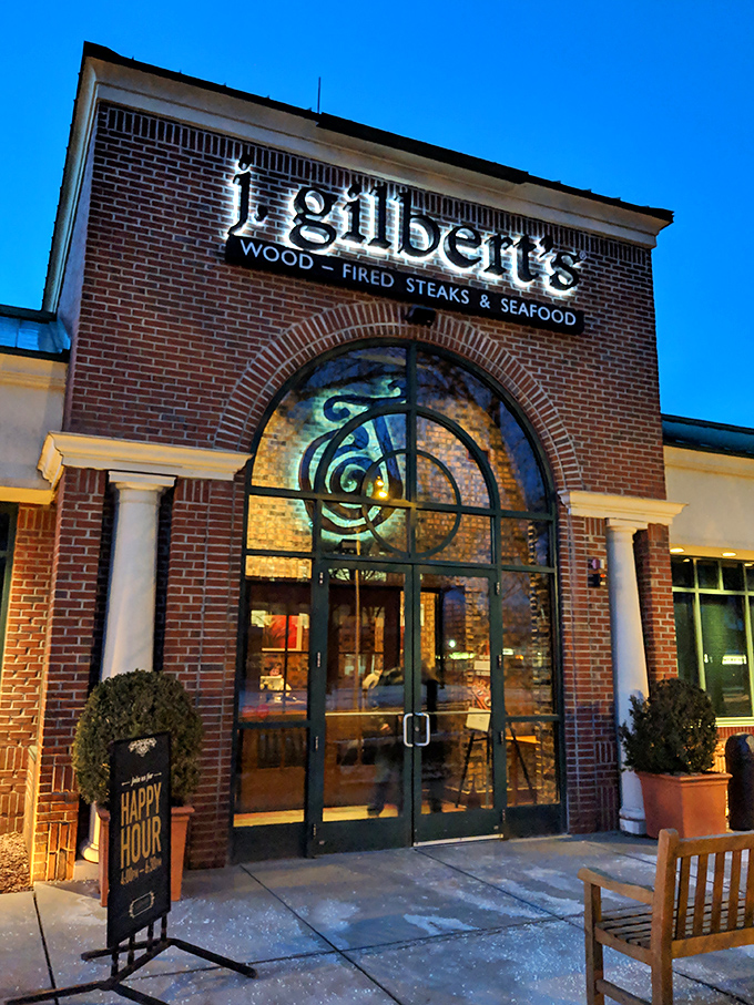 The brick facade of J. Gilbert's stands like a sentry guarding culinary treasures, its arched entrance beckoning hungry pilgrims to the promised land of prime rib.