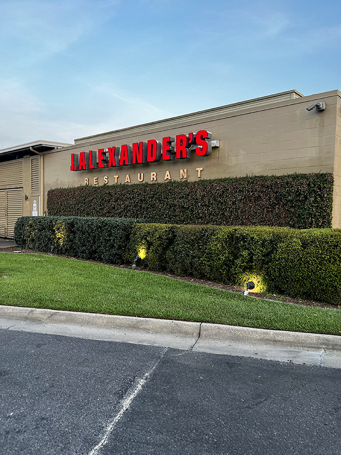 The iconic red lettering against stone and wood welcomes you like an old friend.