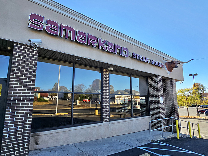 The unassuming exterior of Samarkand hides culinary treasures within, like finding a Picasso at a yard sale. The steer silhouette signals carnivorous delights await.