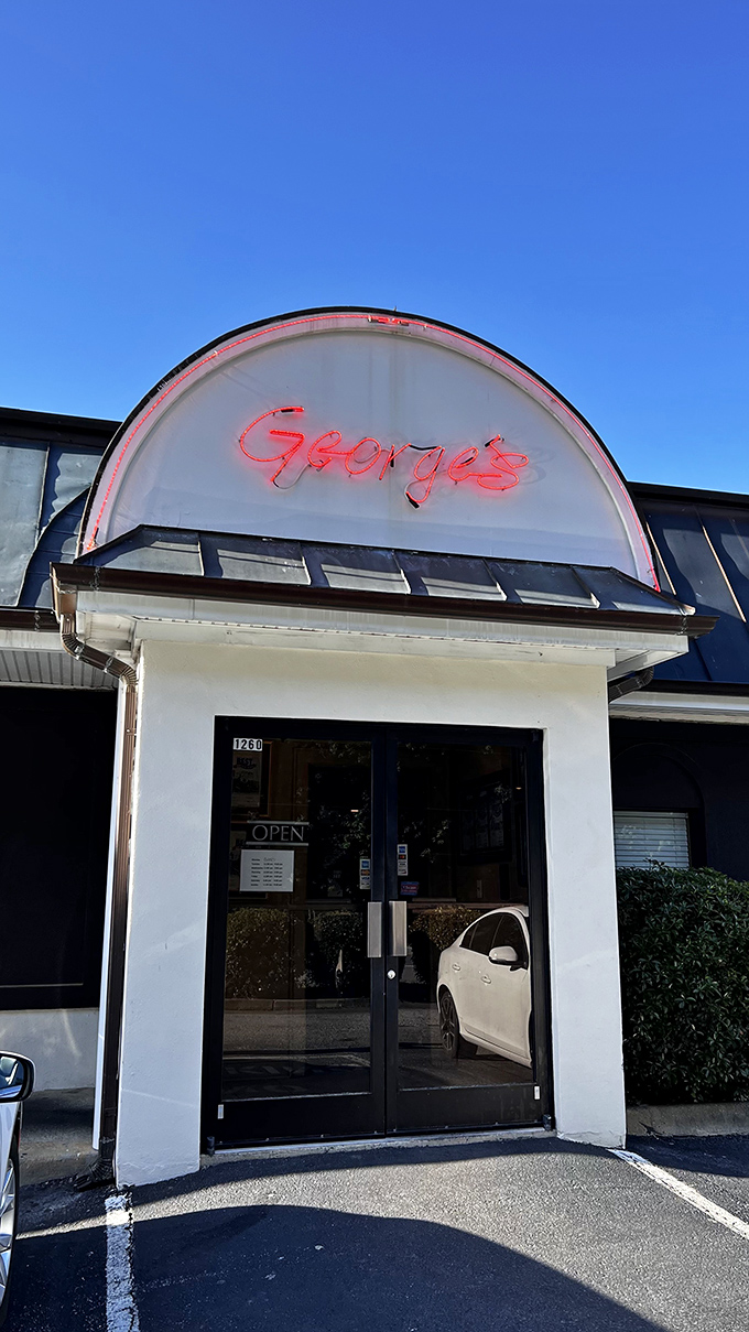 The unassuming exterior of George's Steak House proves once again that culinary greatness often hides behind modest facades. Suffolk's worst-kept secret awaits.